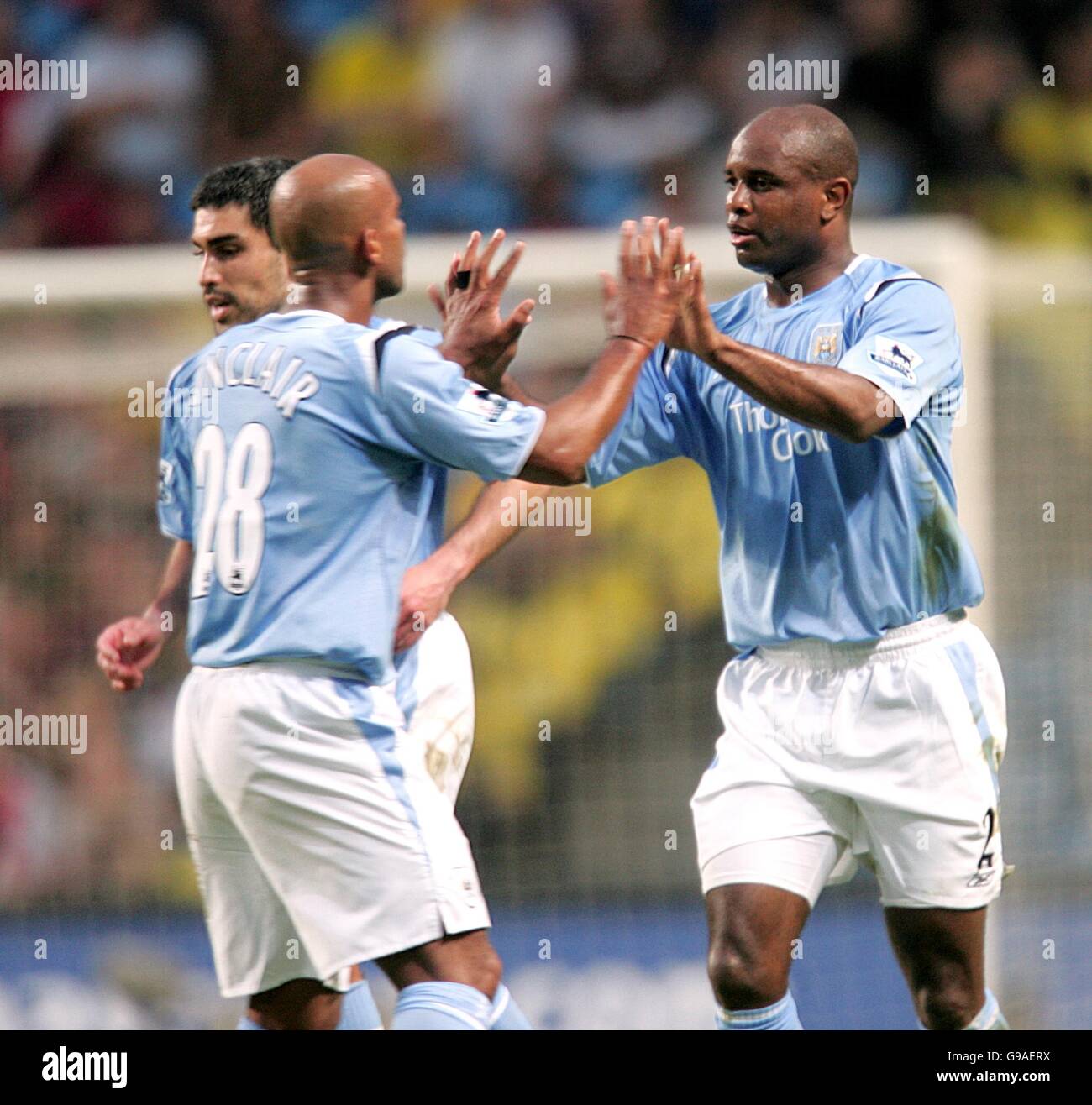 (R-L) Manchester City 's Trevor Sinclair congratulates goal scorer ...