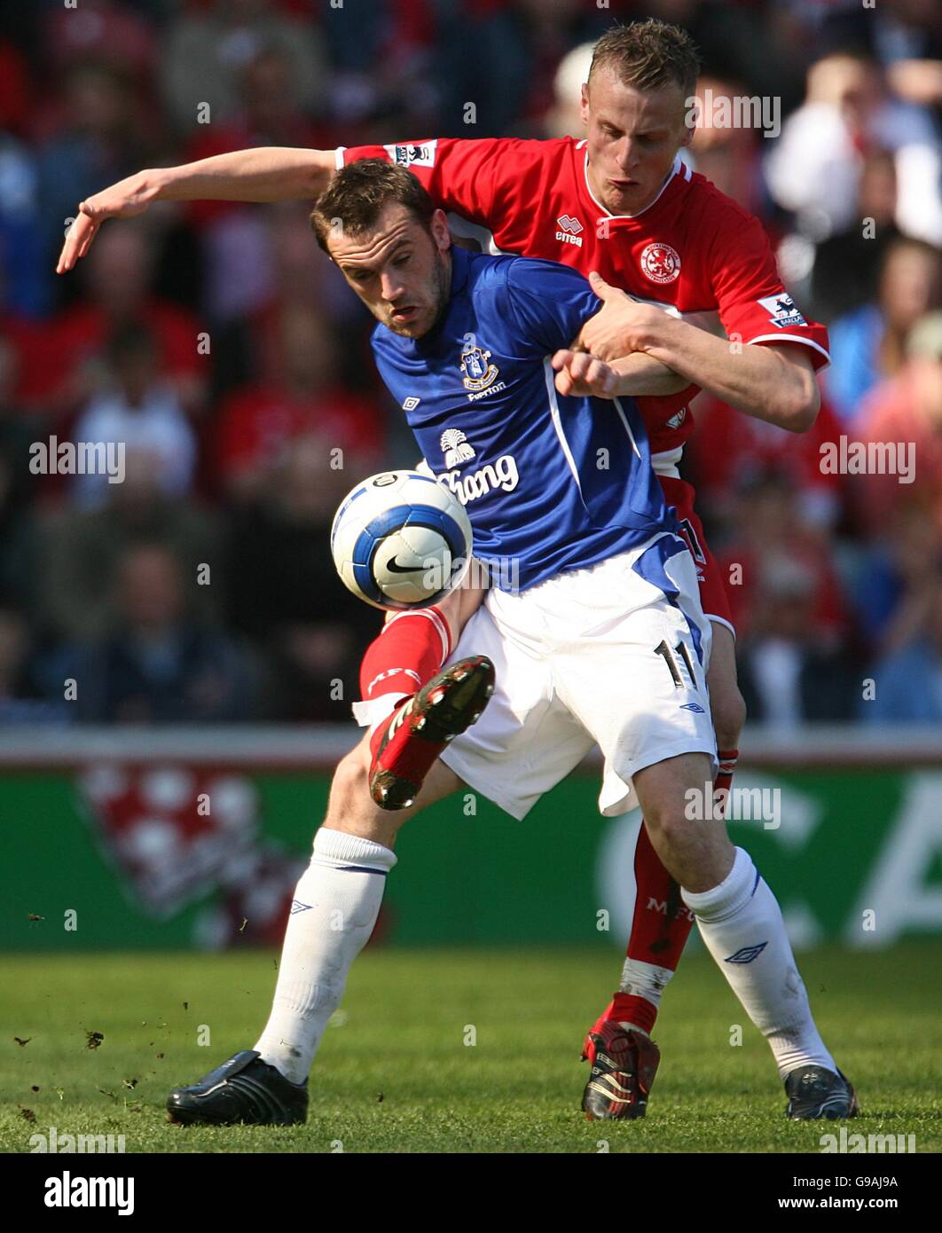Everton's James McFadden is challenged by Middlesbrough's David Wheater ...