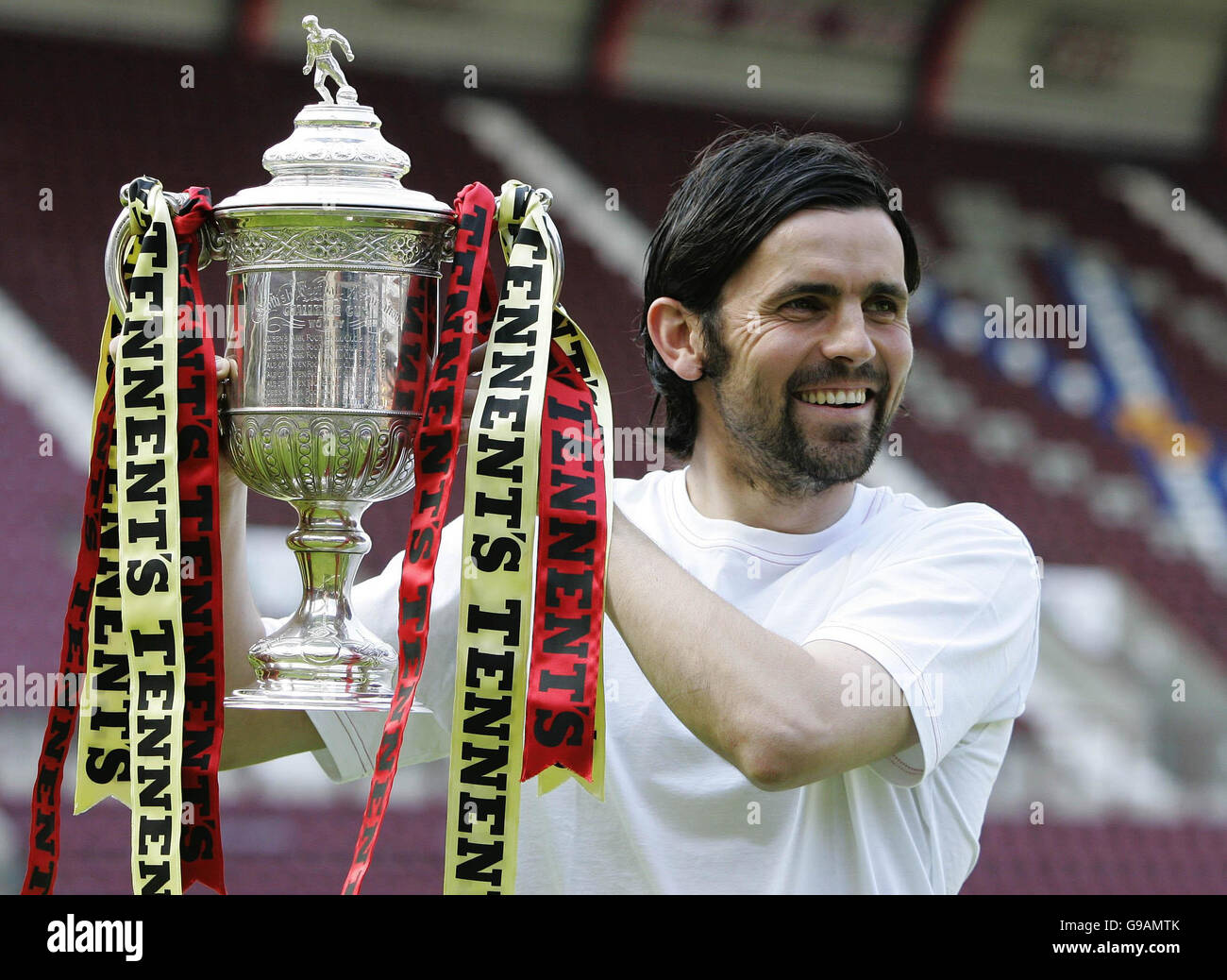 Hearts' Paul Hartley holds the Tennent's Scottish Cup during a media ...