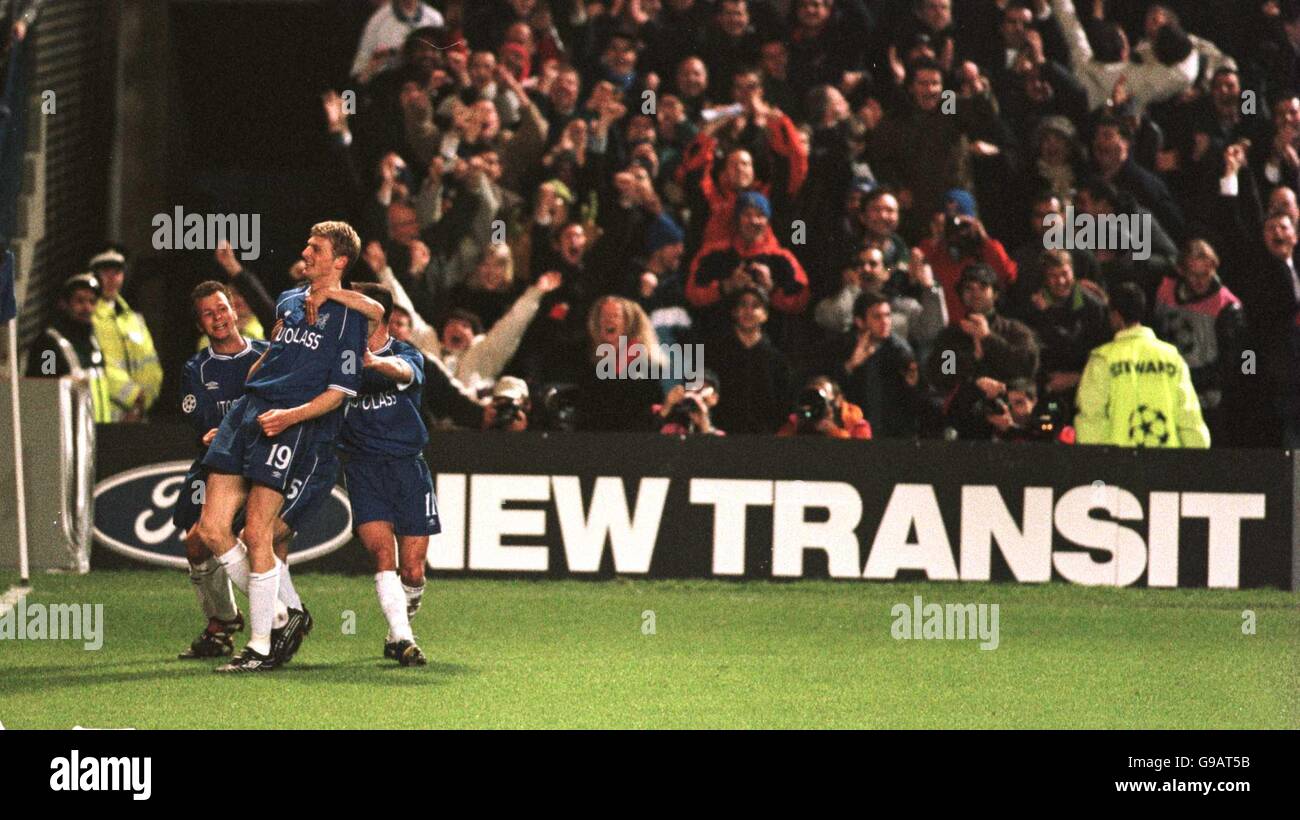 Chelsea's Tore Andre Flo (c) celebrates scoring a goal with Jody Morris ...