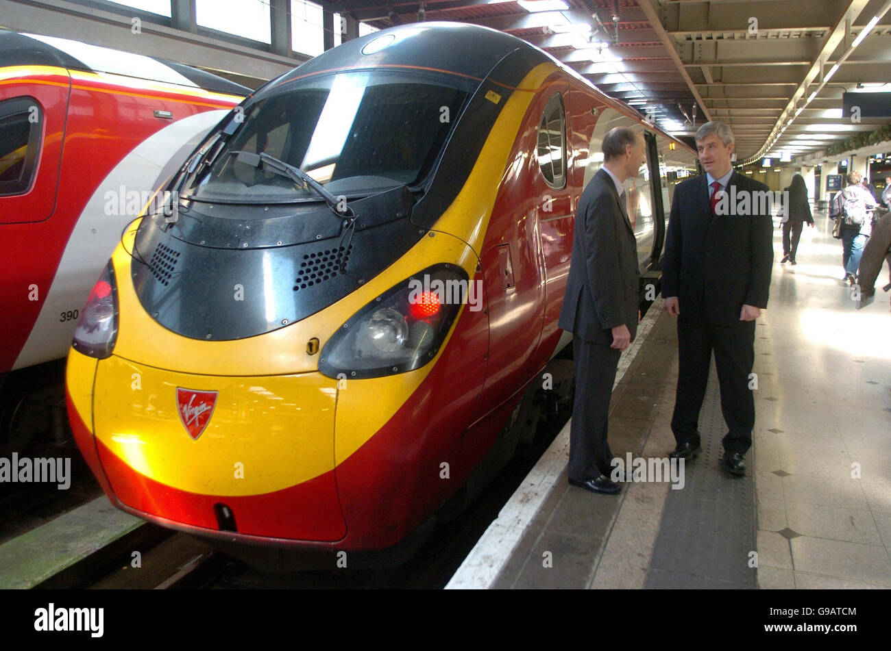 The Rail Minister Derek Twigg (right) talks to Virgin Train's Managing ...