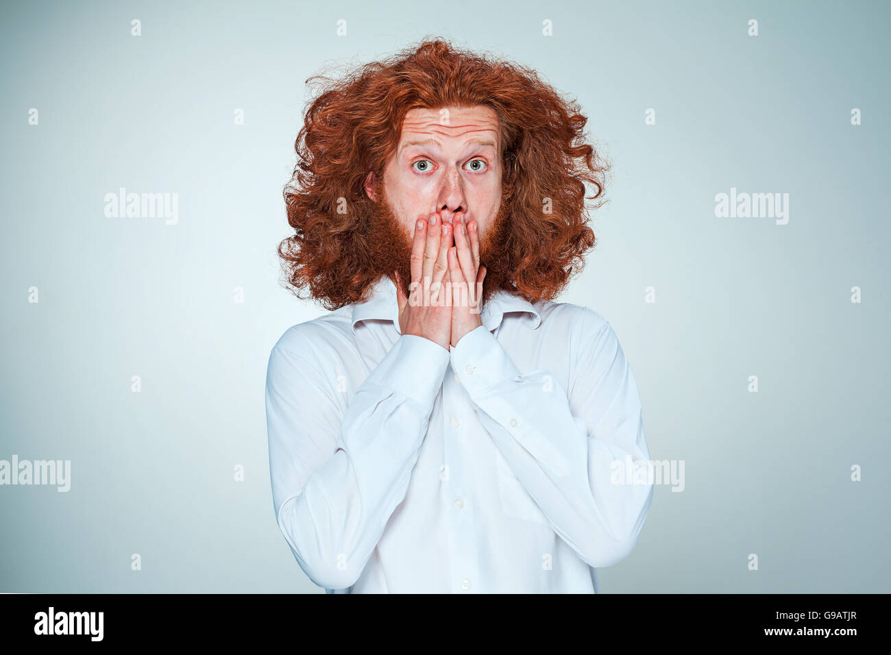 Portrait of young man with shocked facial expression Stock Photo - Alamy
