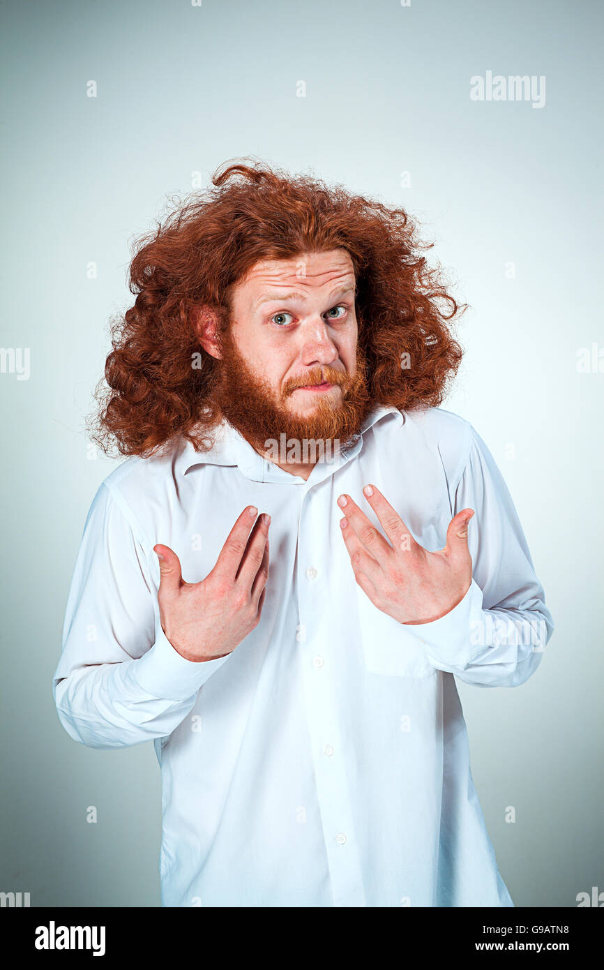 Portrait of young man with shocked facial expression Stock Photo - Alamy