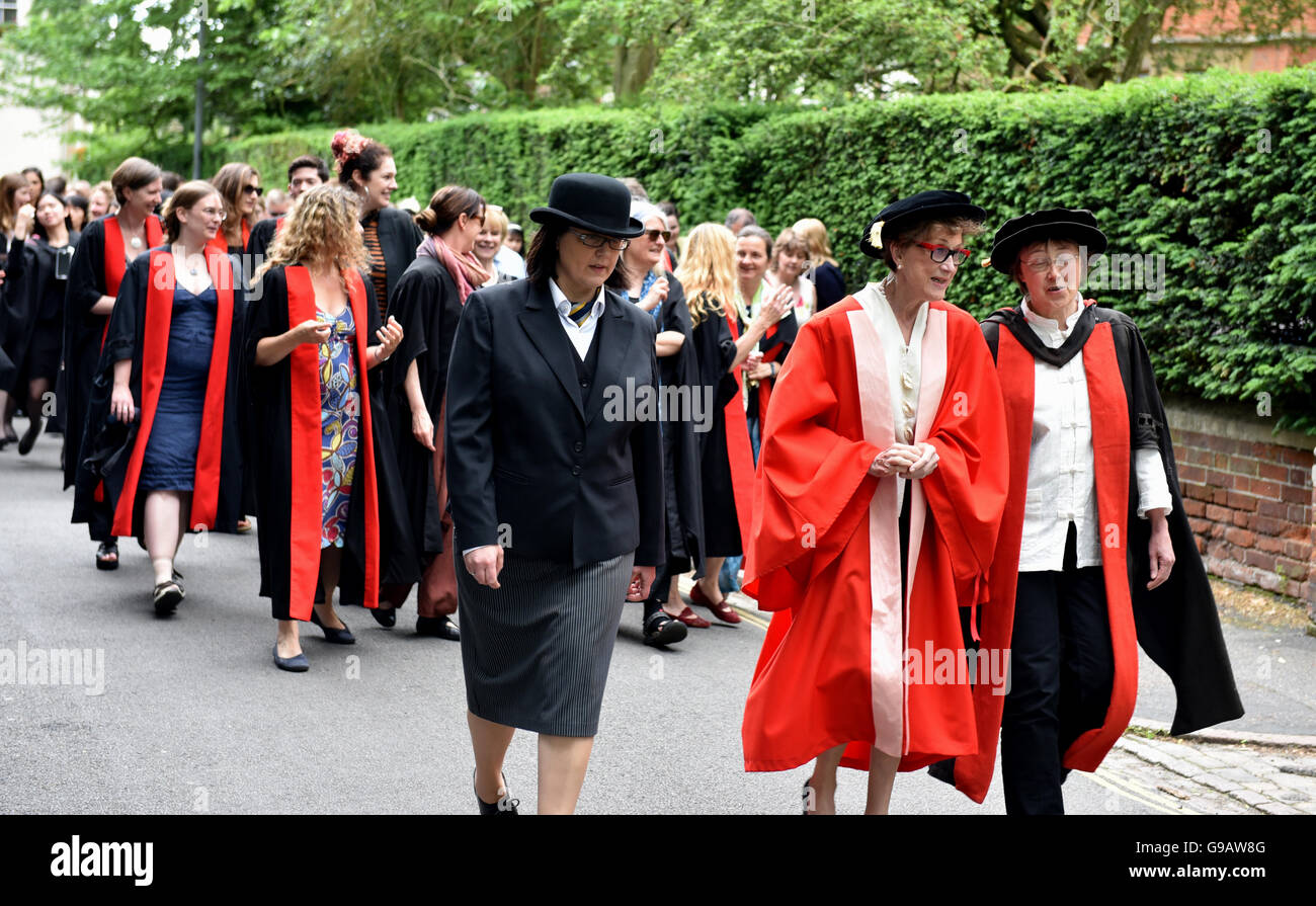 A parade of students is lead by professors at Cambridge University ...