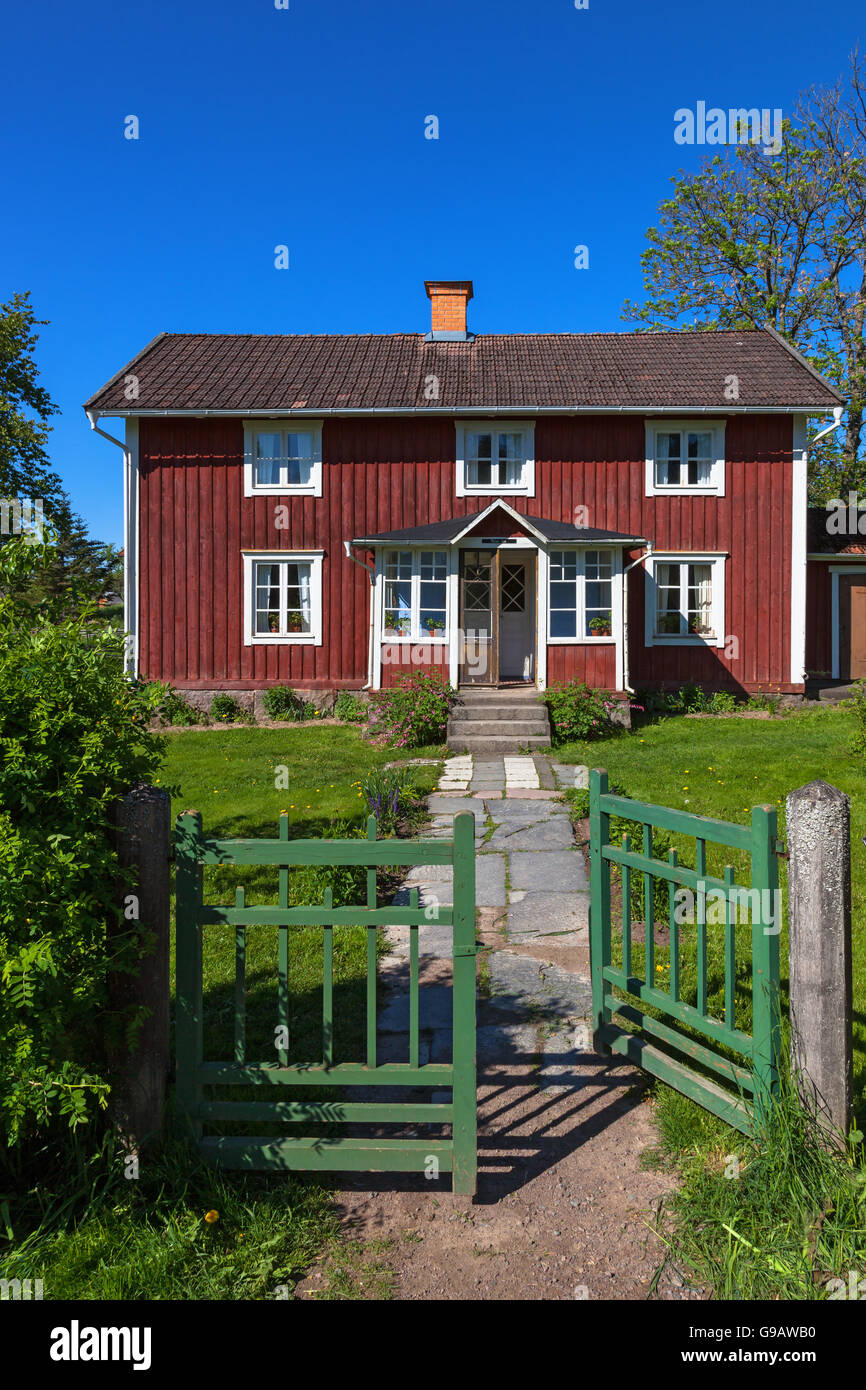 Rural house with a gate in the countryside Stock Photo - Alamy