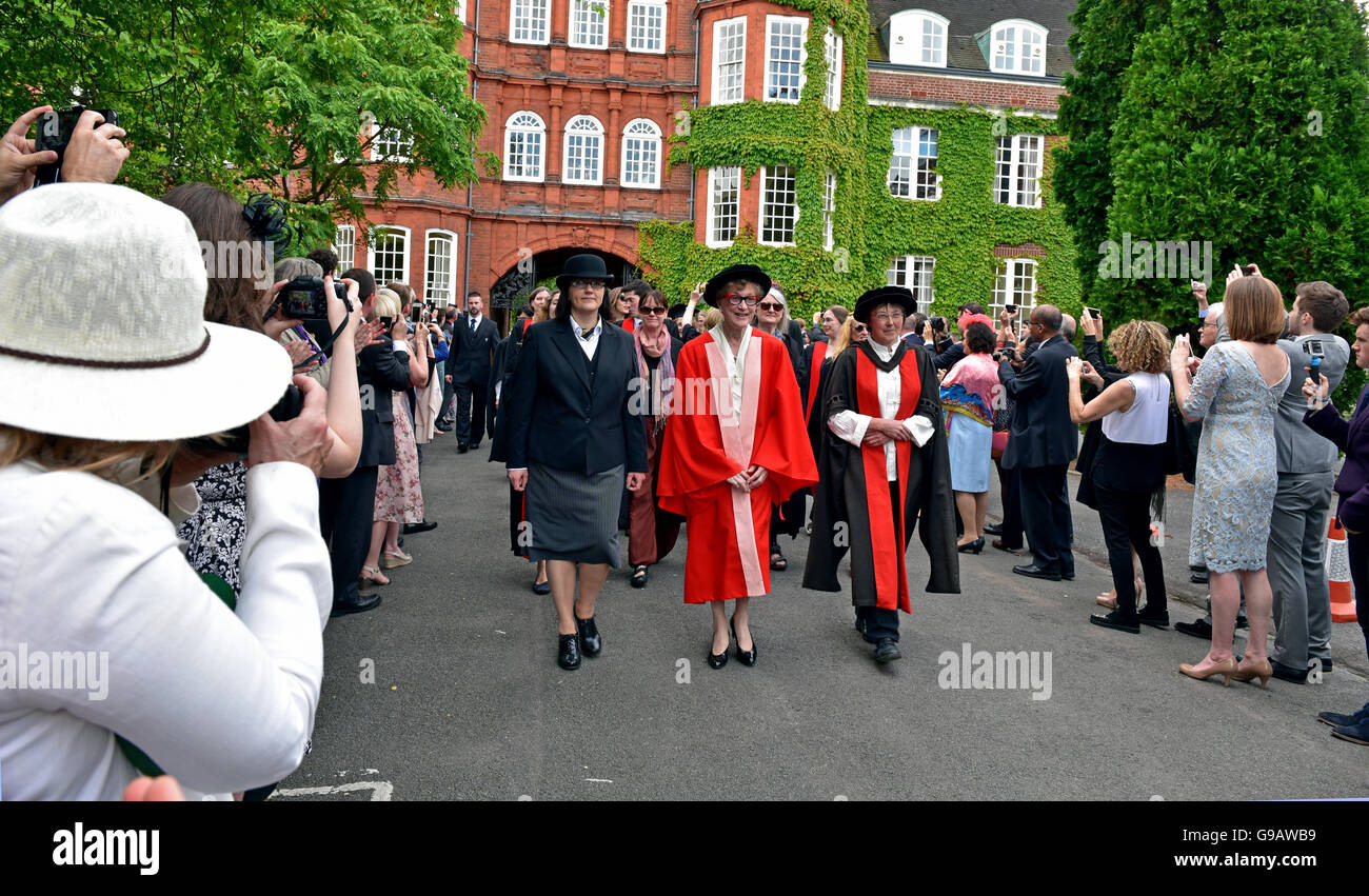 A parade of students is lead by professors at Cambridge University ...
