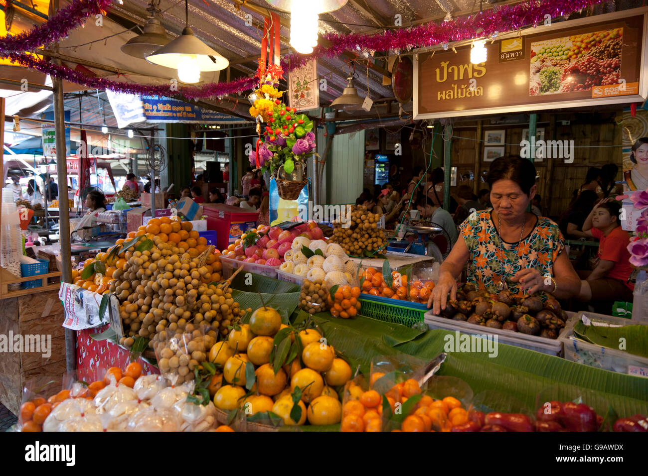 A fruit stall with a range of fruits at the fresh market in Maeklong in ...