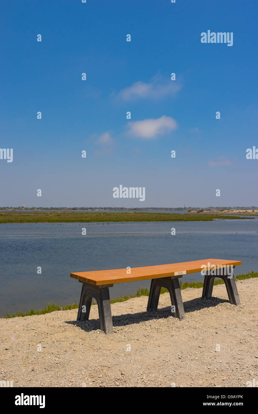 Park bench looks out over tidal pools in Pacific wetlands Stock Photo ...