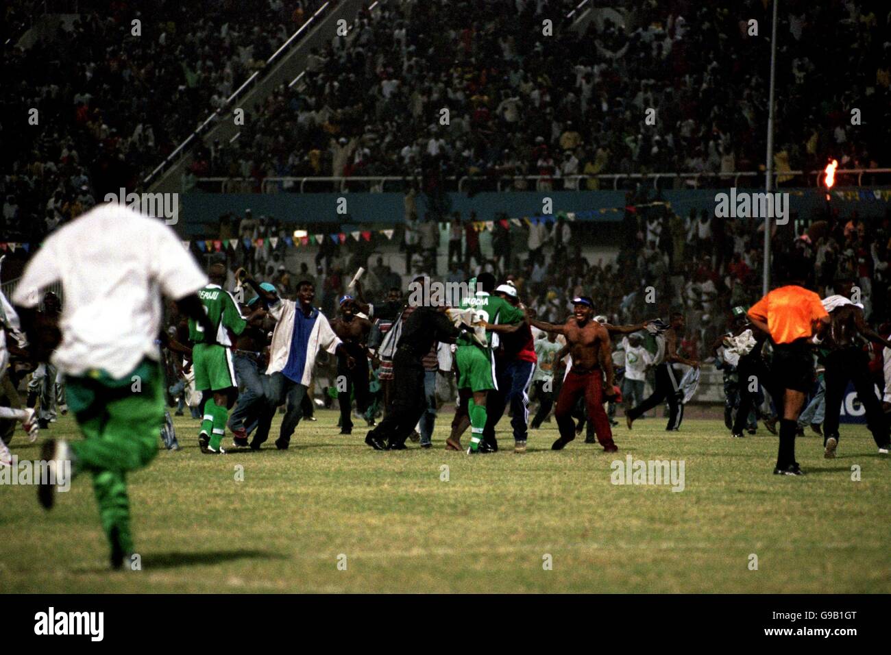 Pitch invasion celebration woohoo running on fans crowd football hi-res ...