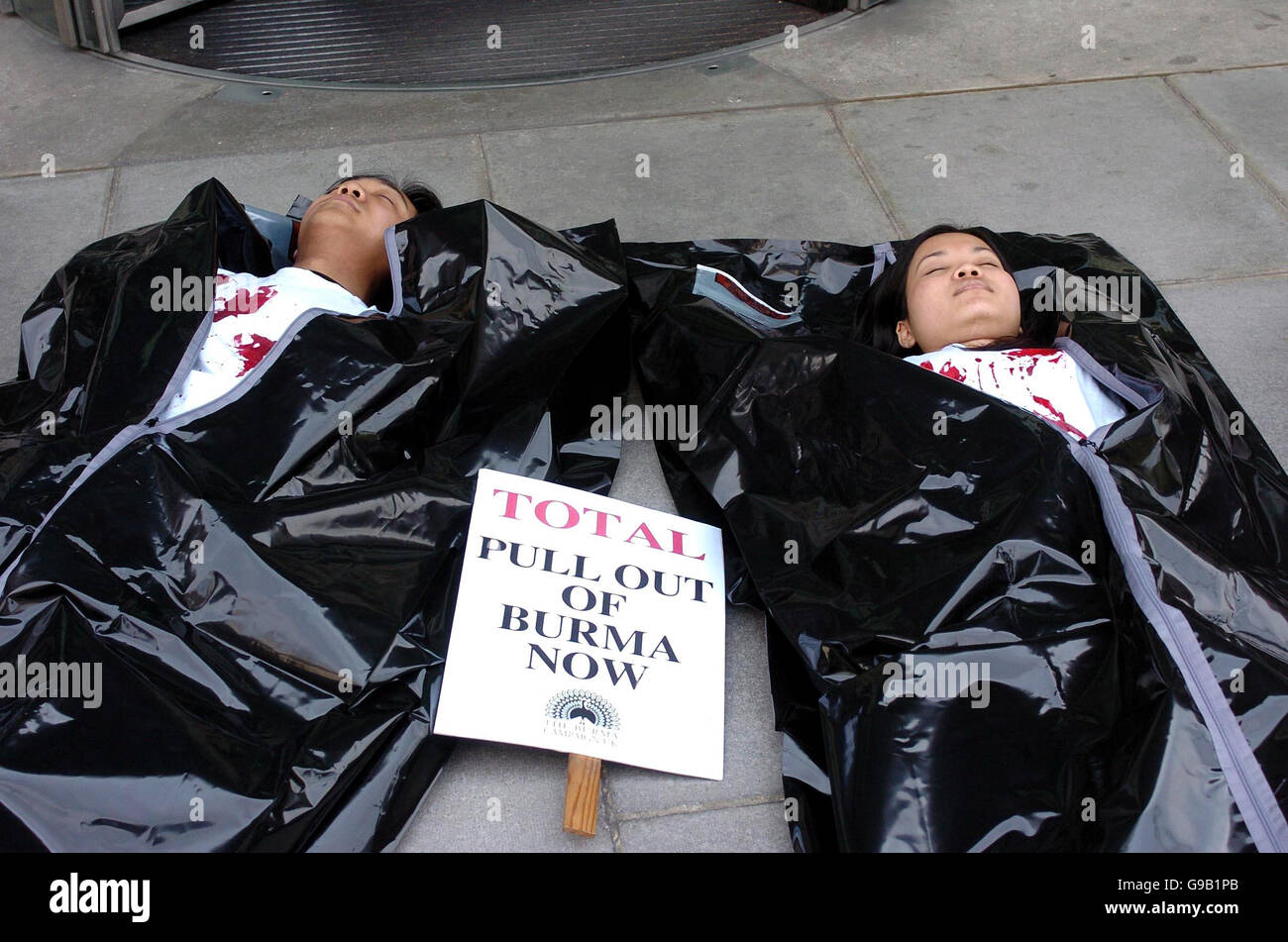 Members of the Burmese community in London protest in body bags outside ...