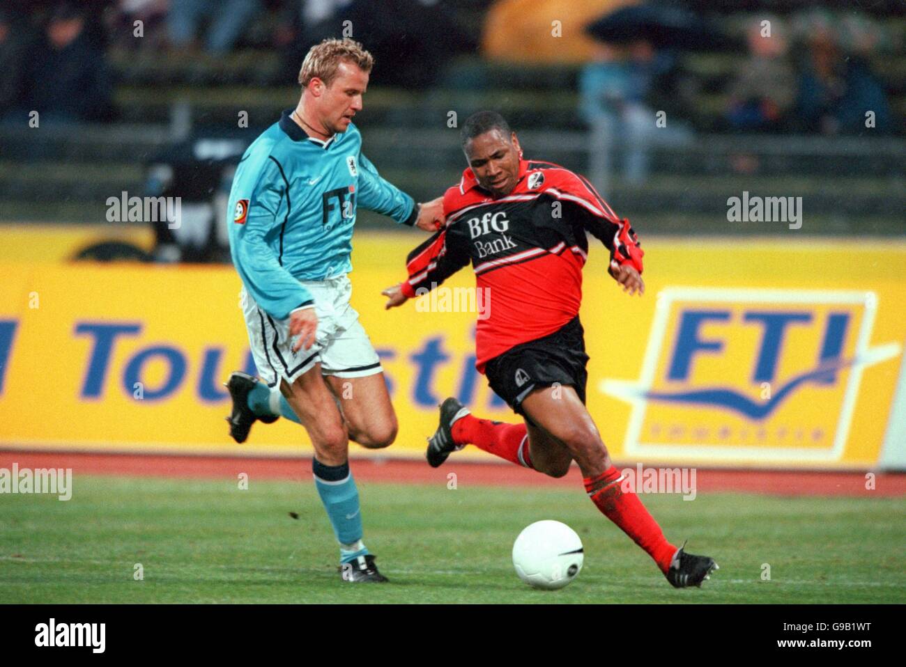 SC Freiburg's Mehdi Ben Slimane (r) takes on 1860 Munich's Holger ...