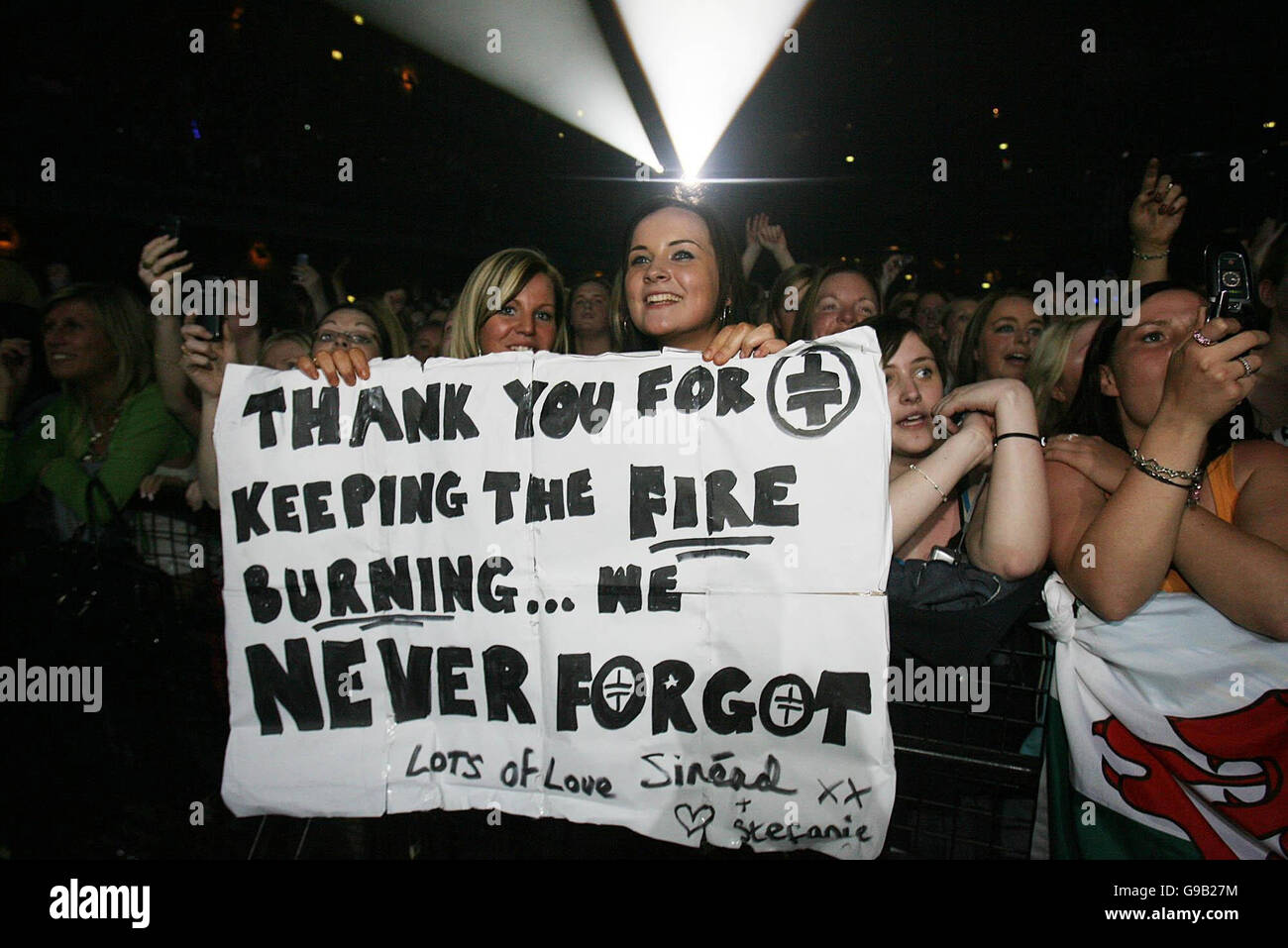 Fans wave a poster as Take That play the first of two sell-out dates at ...