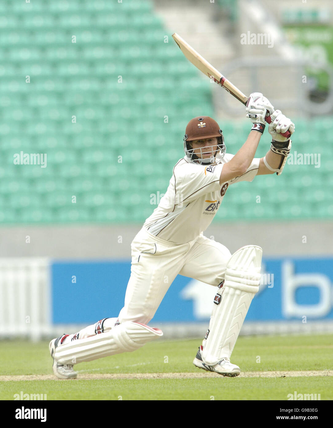 Surrey's Jonathan Batty drives to the point boundary on the way to his ...