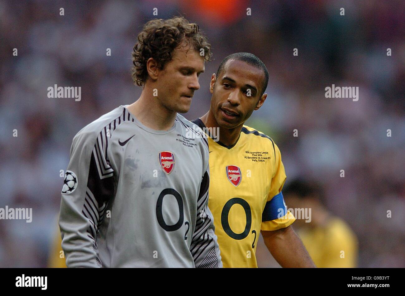 Arsenal's goalkeeper Jens Lehmann is consoled by Thierry Henry after ...