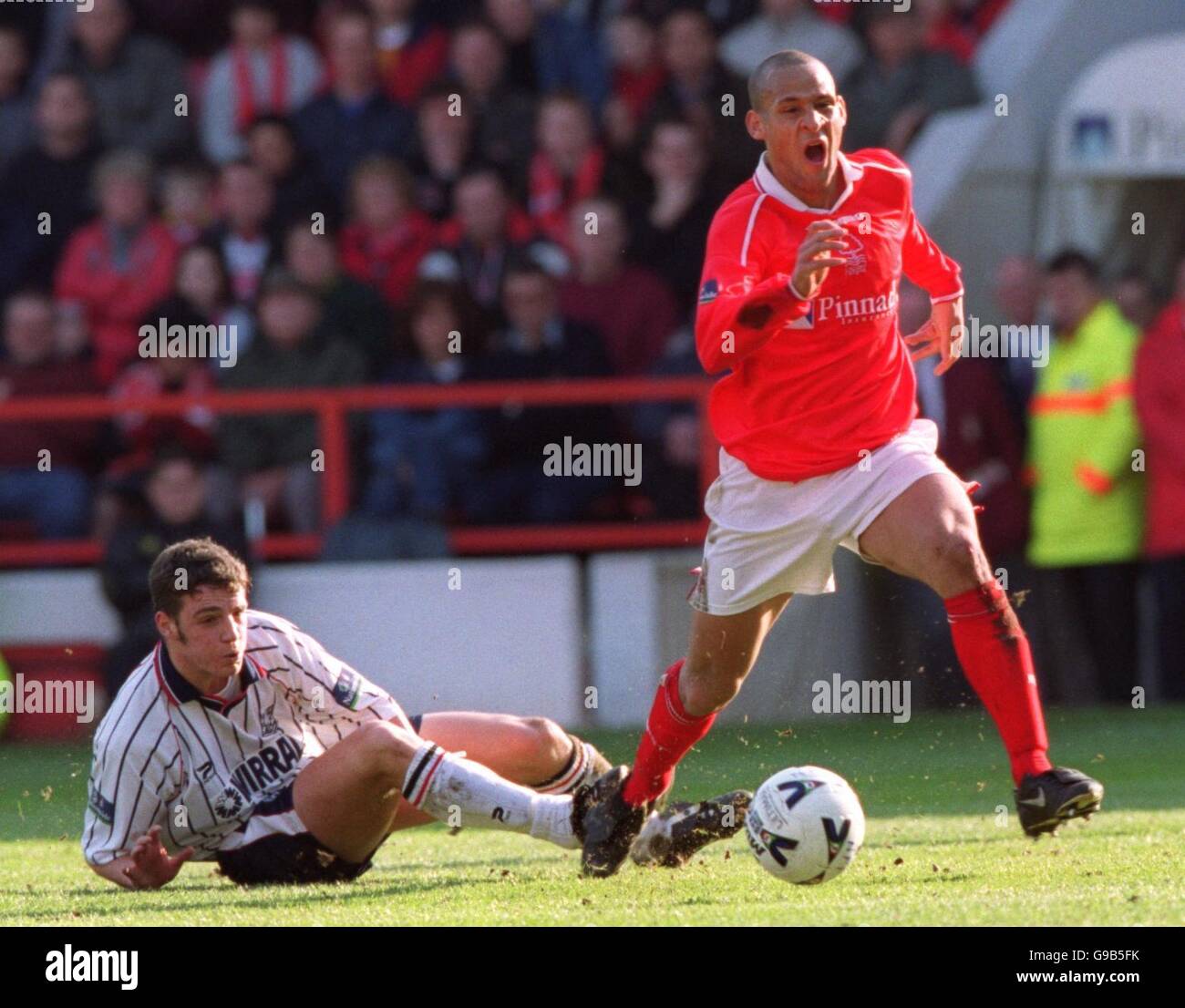 (L-R) Tranmere Rovers' Jason Koumas tackles Nottingham Forest's Nigel ...
