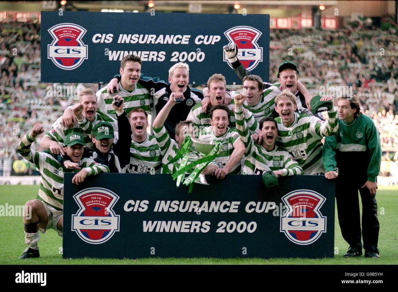 Celtic, led by captain Tommy Boyd (holding cup), celebrate their 2-0 ...