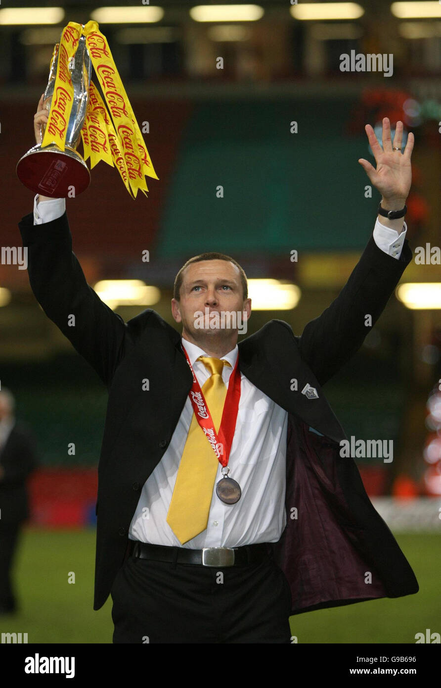 Watford manager Adrian Boothroyd celebrates with trophy after defeating ...
