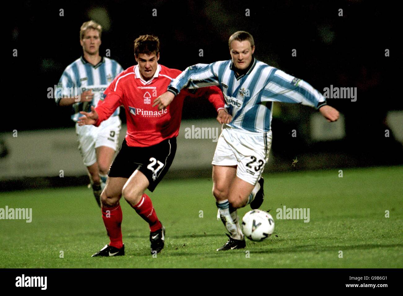 (L-R) Nottingham Forest's Andy Gray battles for possession of the ball ...