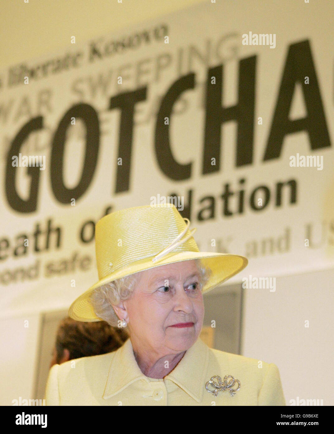 Britain's Queen Elizabeth II passes boards of British newspaper ...