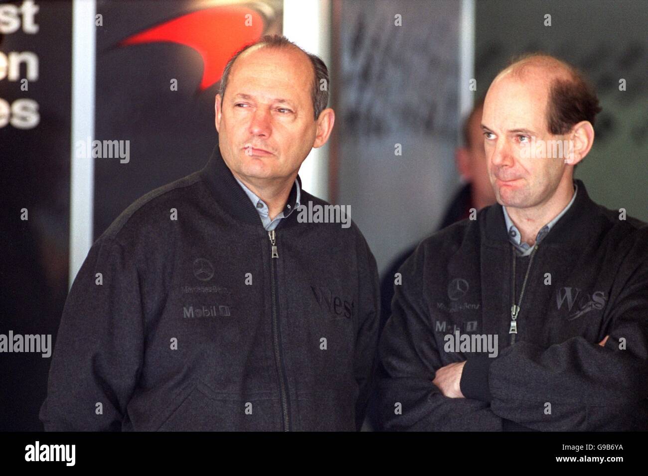 (L-R) McLaren boss Ron Dennis chats to technical director Adrian Newey ...