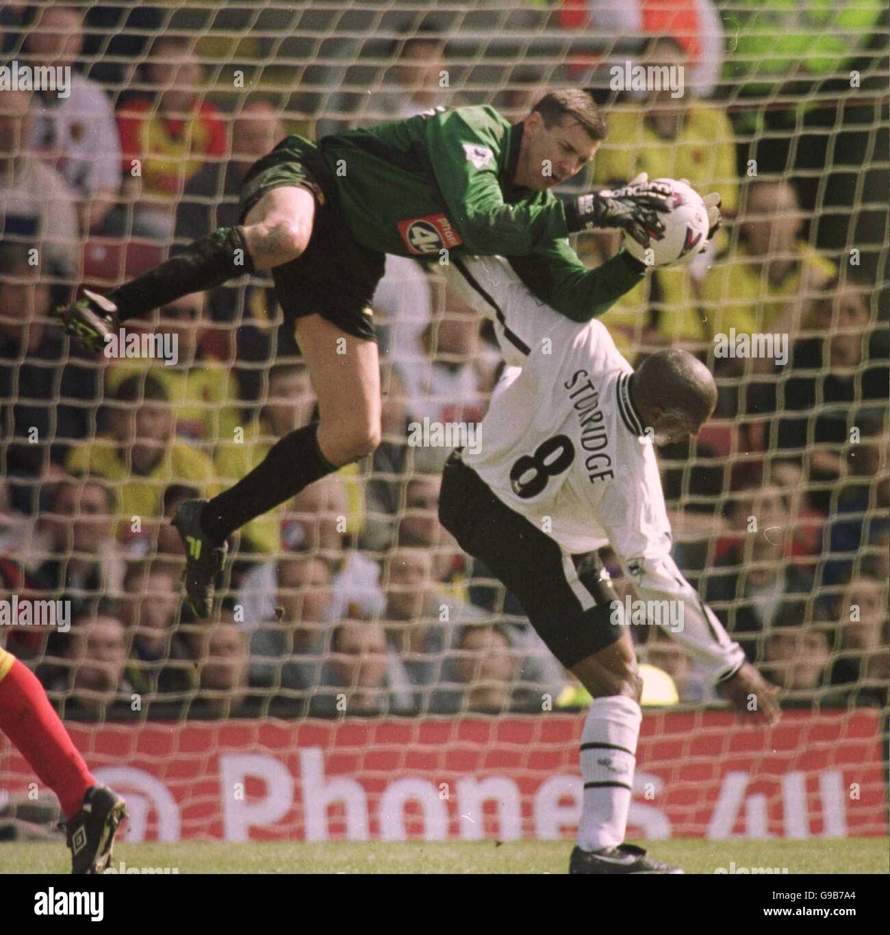 Watford's goalkeeper Alec Chamberlain is acrobatic as he takes control ...