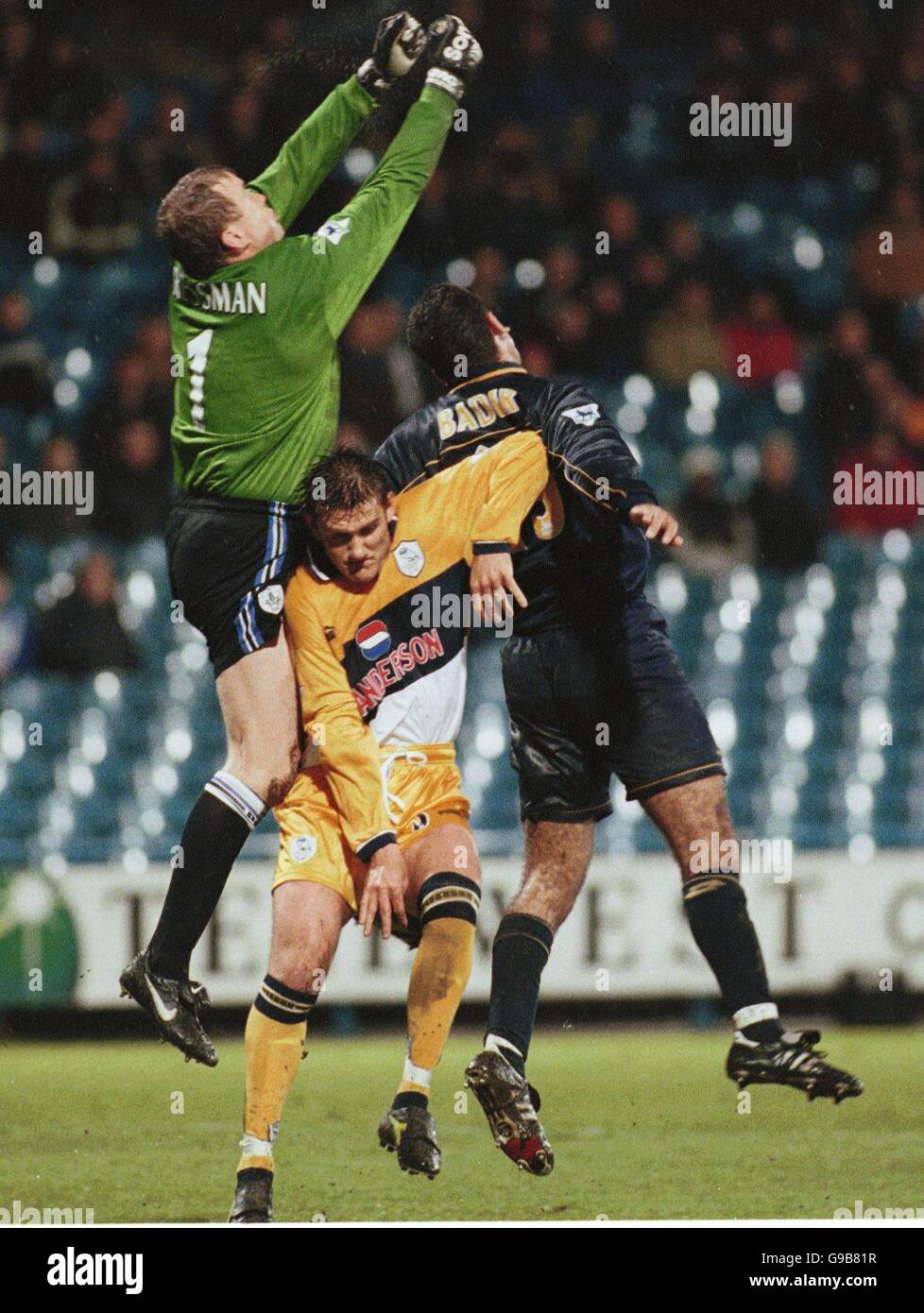 Wimbledon's Walid Badir collides with Sheffield Wednesday's goalkeeper ...