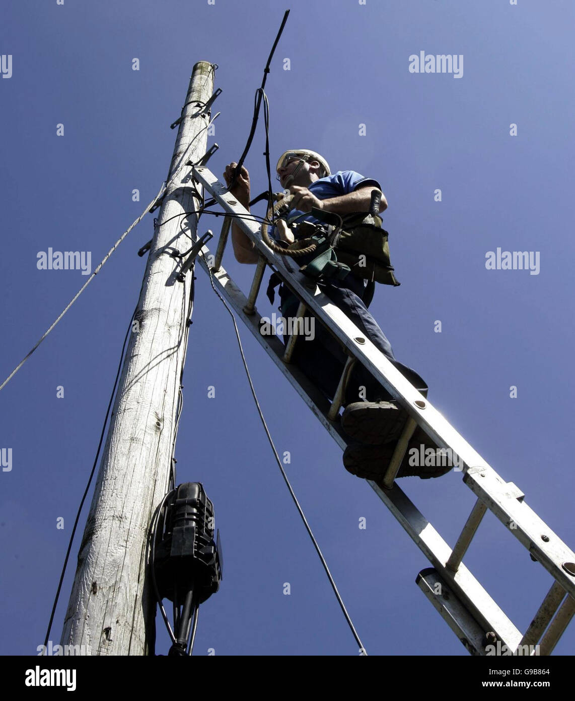 A generic picture of British Telecom engineers removing old telecom ...