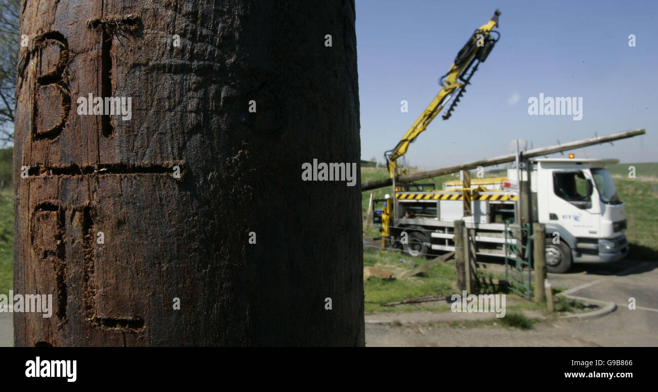 A generic picture of British Telecom engineers removing old telecom ...
