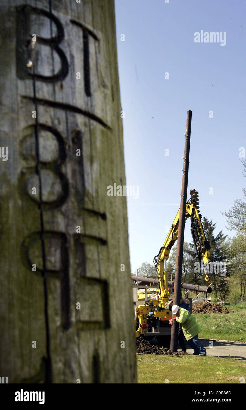 A generic picture of British Telecom engineers removing old telecom ...