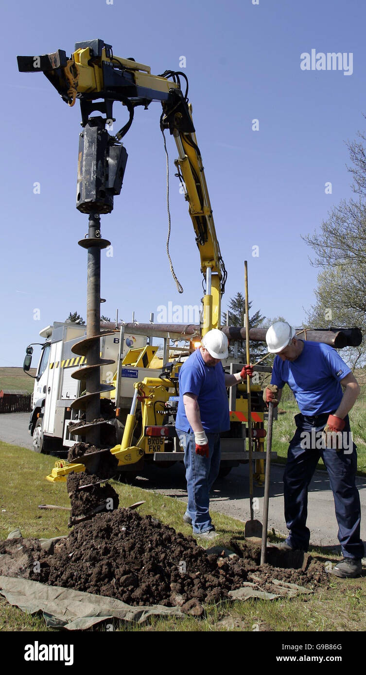 A generic picture of British Telecom engineers removing old telecom ...