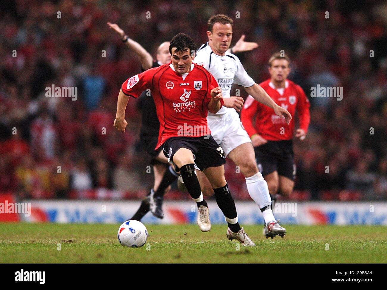 (L-R) Barnsley's Bobby Hassell and Swansea City's Kristian O'Leary ...
