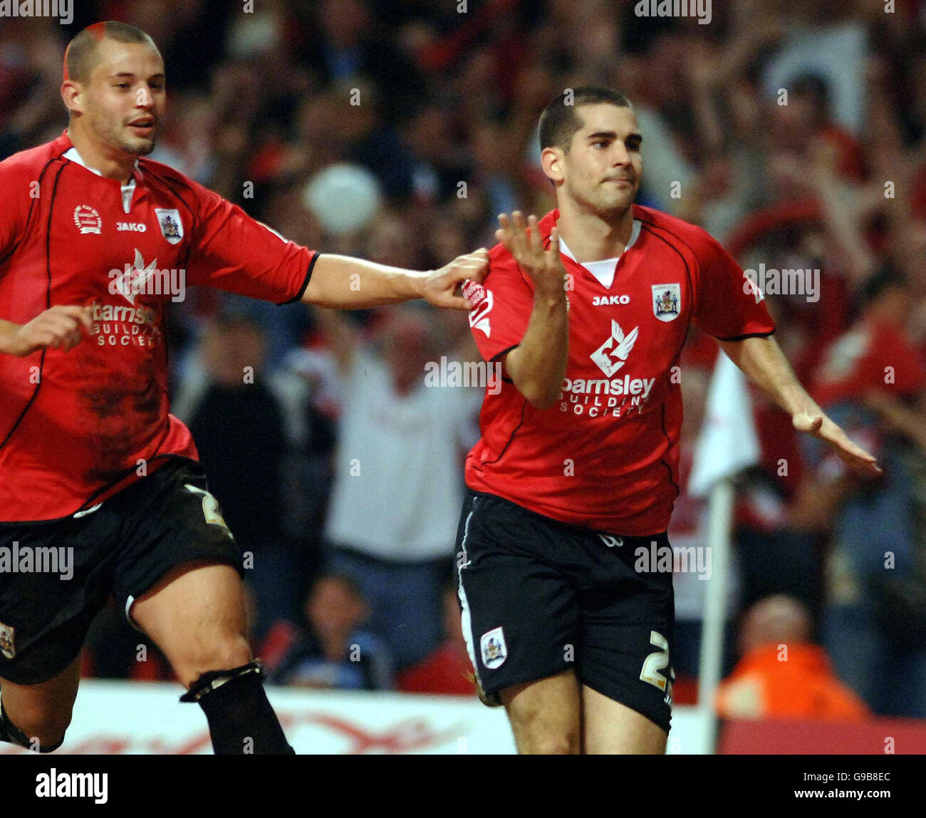 Barnsley's Daniel Nardiello celebrates his equaliser during the Coca ...