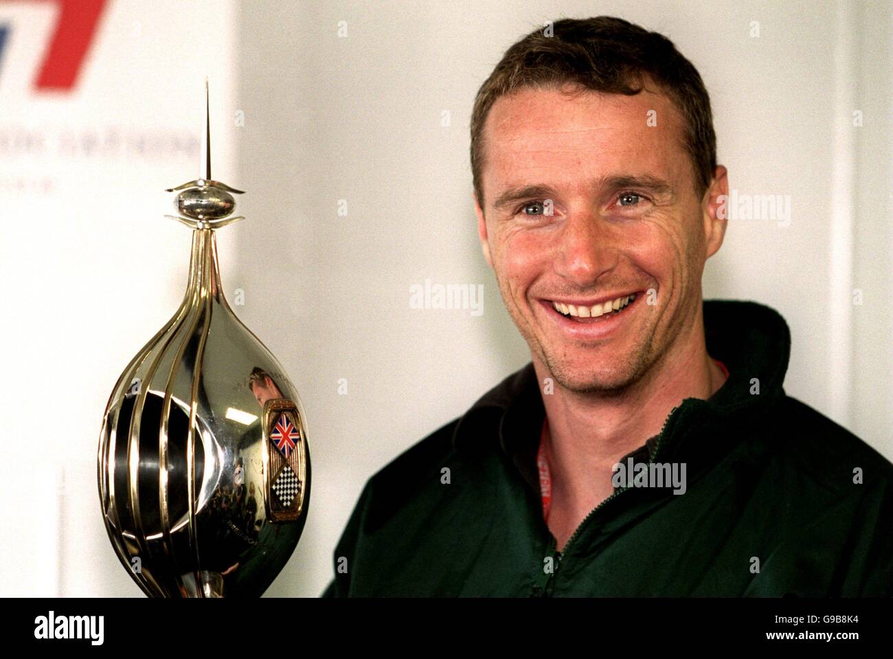 Eddie Irvine is presented with the Hawthorne trophy as the highest ...