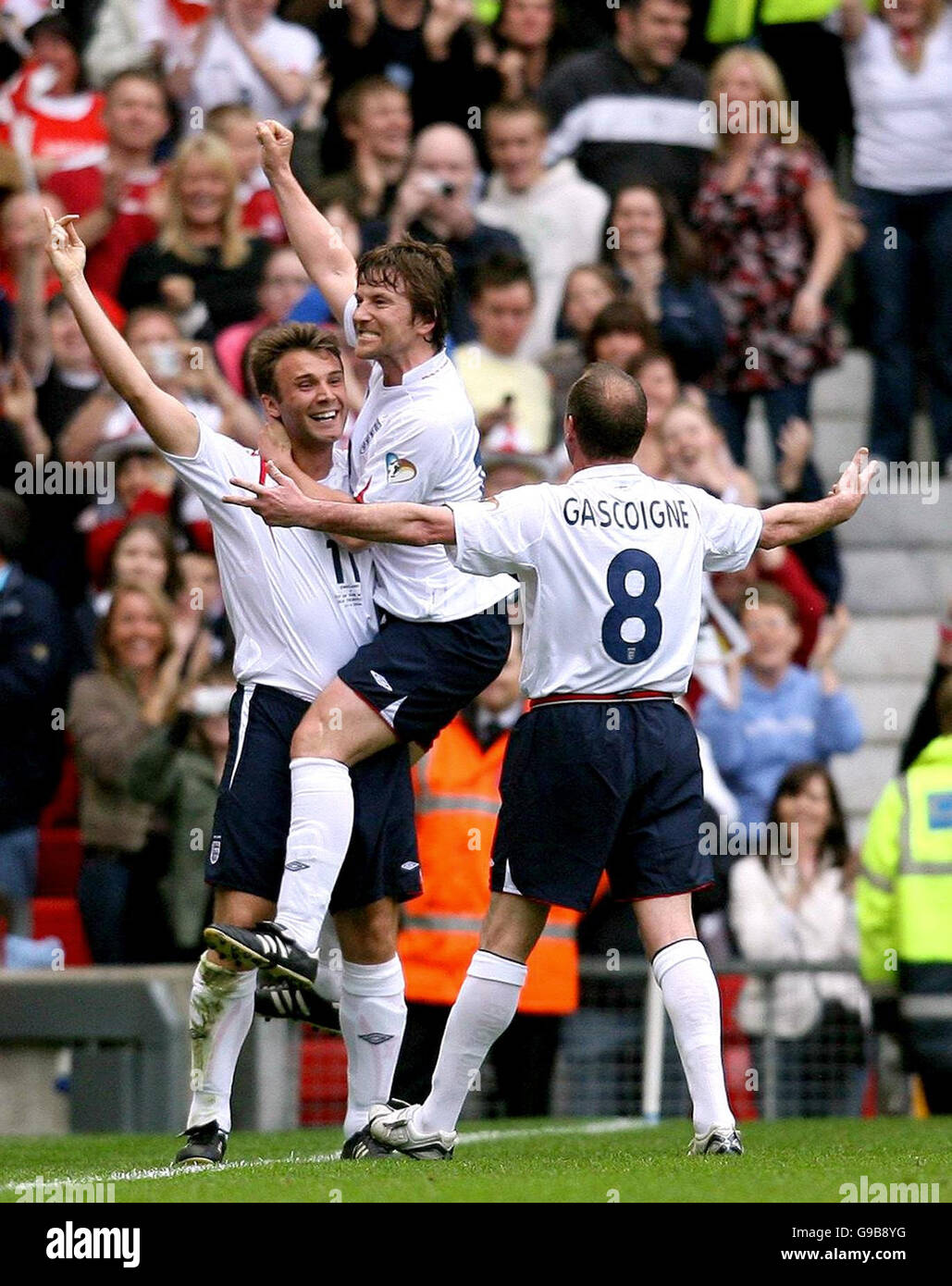 Jonathan Wilkes (left) celebrates scoring England's second goal with ...