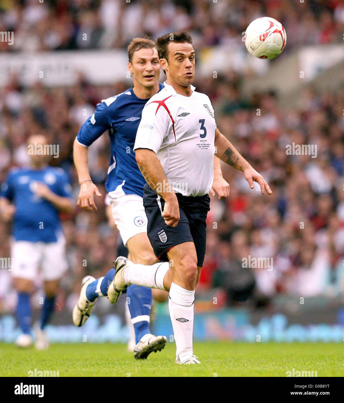 England team captain Robbie Williams (right) in action against the Rest ...