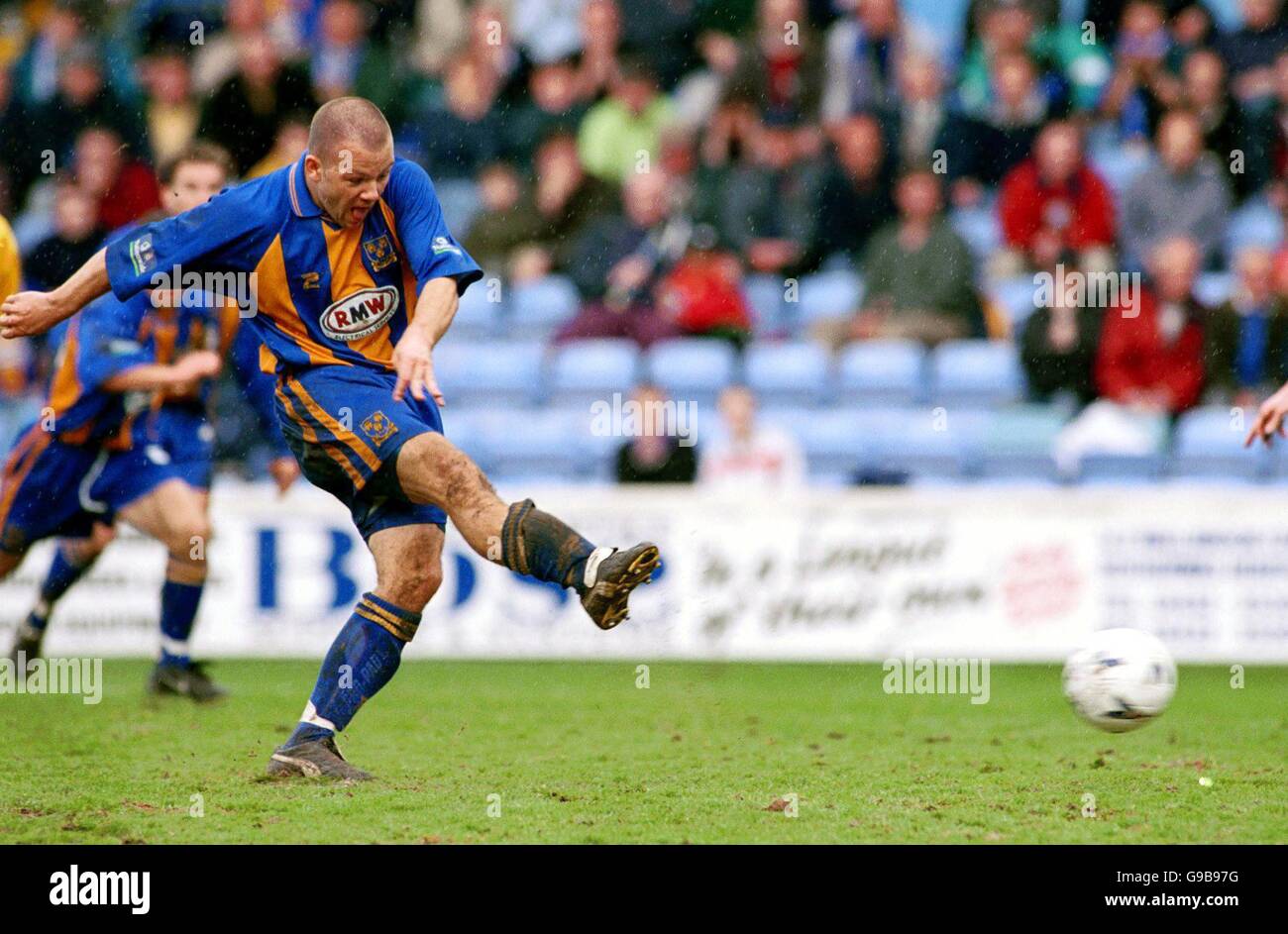 Shrewsbury Town's Lee Steele scores the second of his two penalties ...