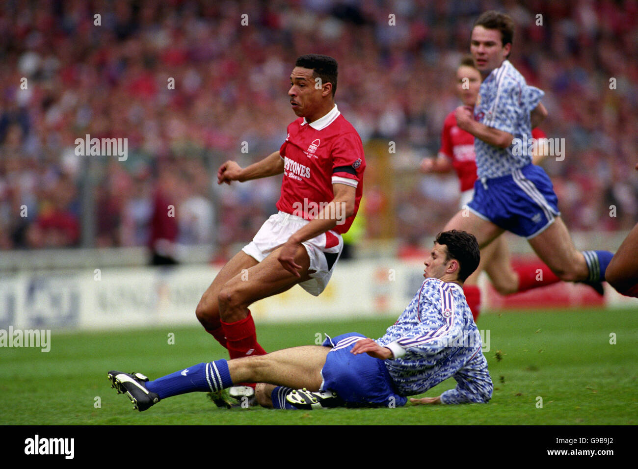 Manchester United's Ryan Giggs (r) slides in on Nottingham Forest's Des ...