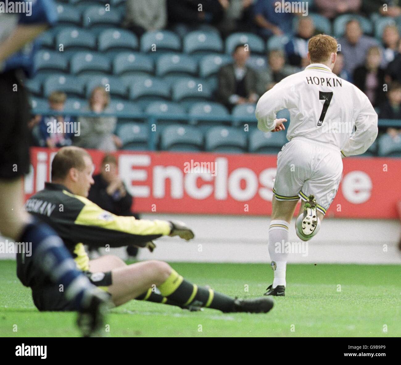 Leed's United's David Hopkin runs to celebrate with team mates after ...