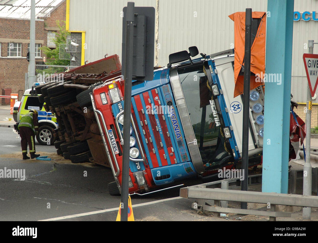 A lorry lies on its side after a road traffic accident at the Ripple ...