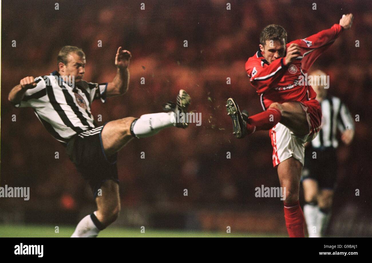 Middlesbrough's Steve Vickers clears from Newcastle's Alan Shearer ...