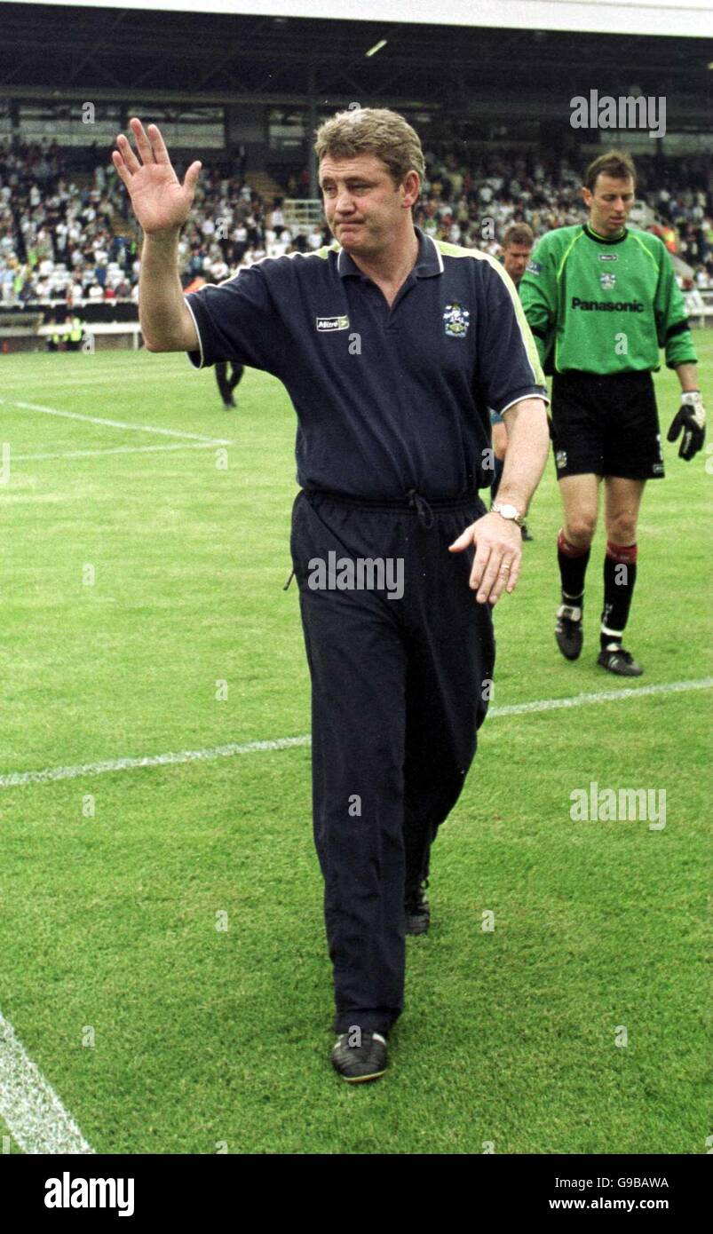 Huddersfield Town manager Steve Bruce salutes his fans after a 3-0 ...