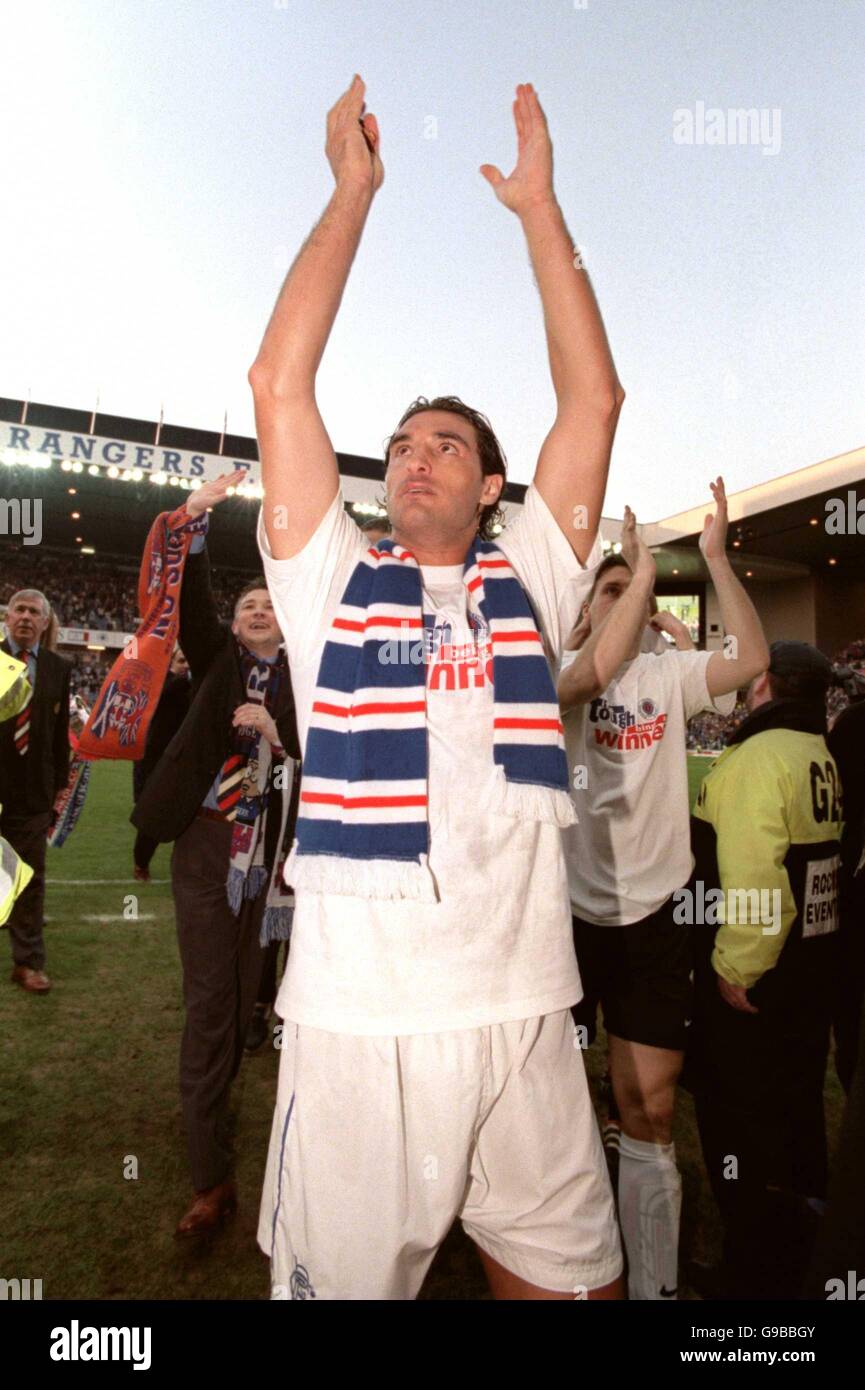 Rangers captain Lorenzo Amoruso celebrates another Championship win ...