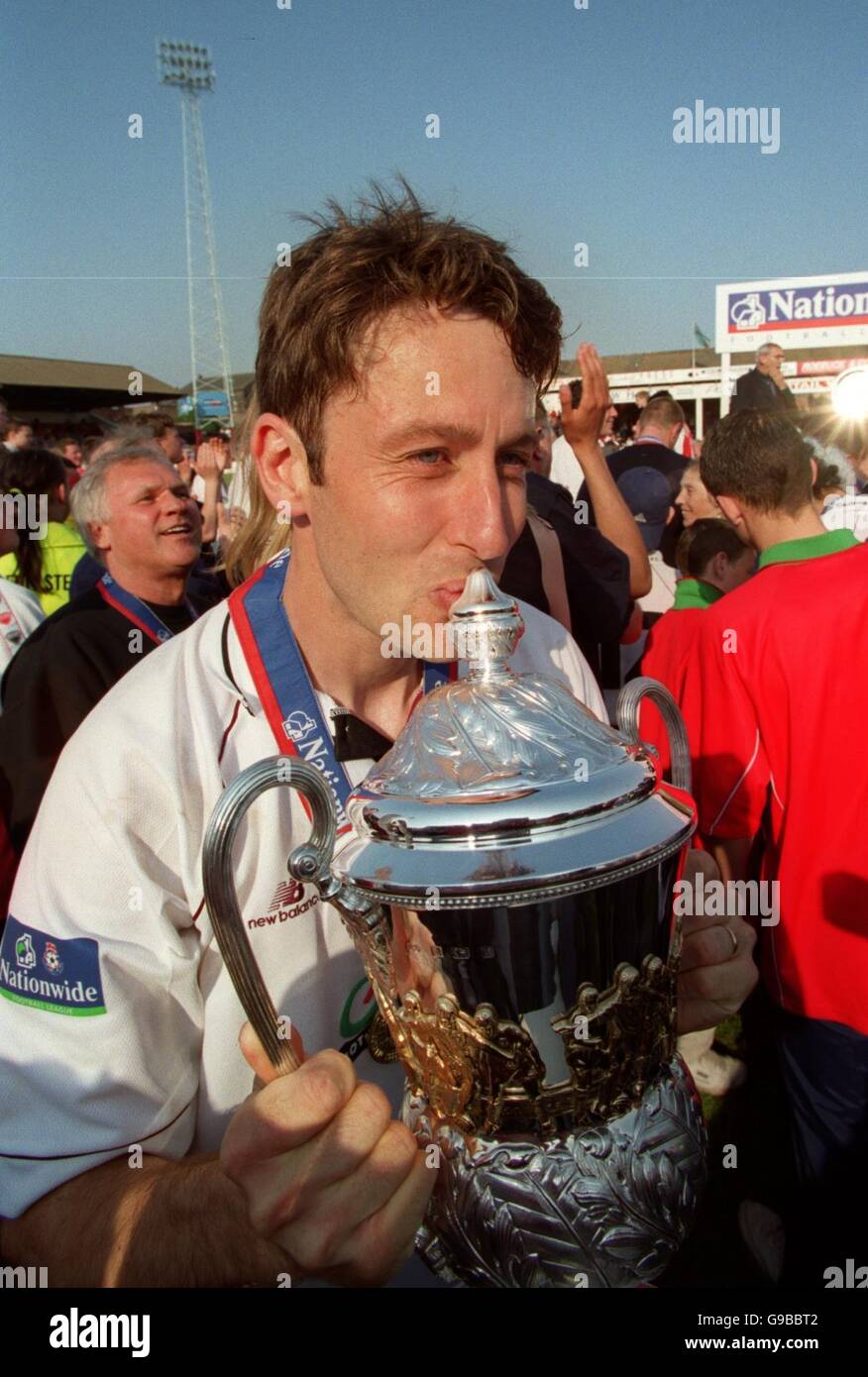 Swansea City captain Nick Cusack celebrates with the Division Three ...