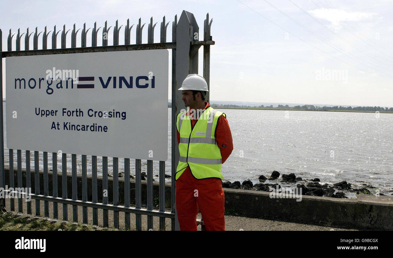 A workman stands overlooking where new work has begun on a second road ...