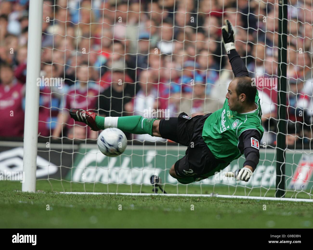 Liverpool's goalkeeper Jose Reina makes a save during the penalty ...