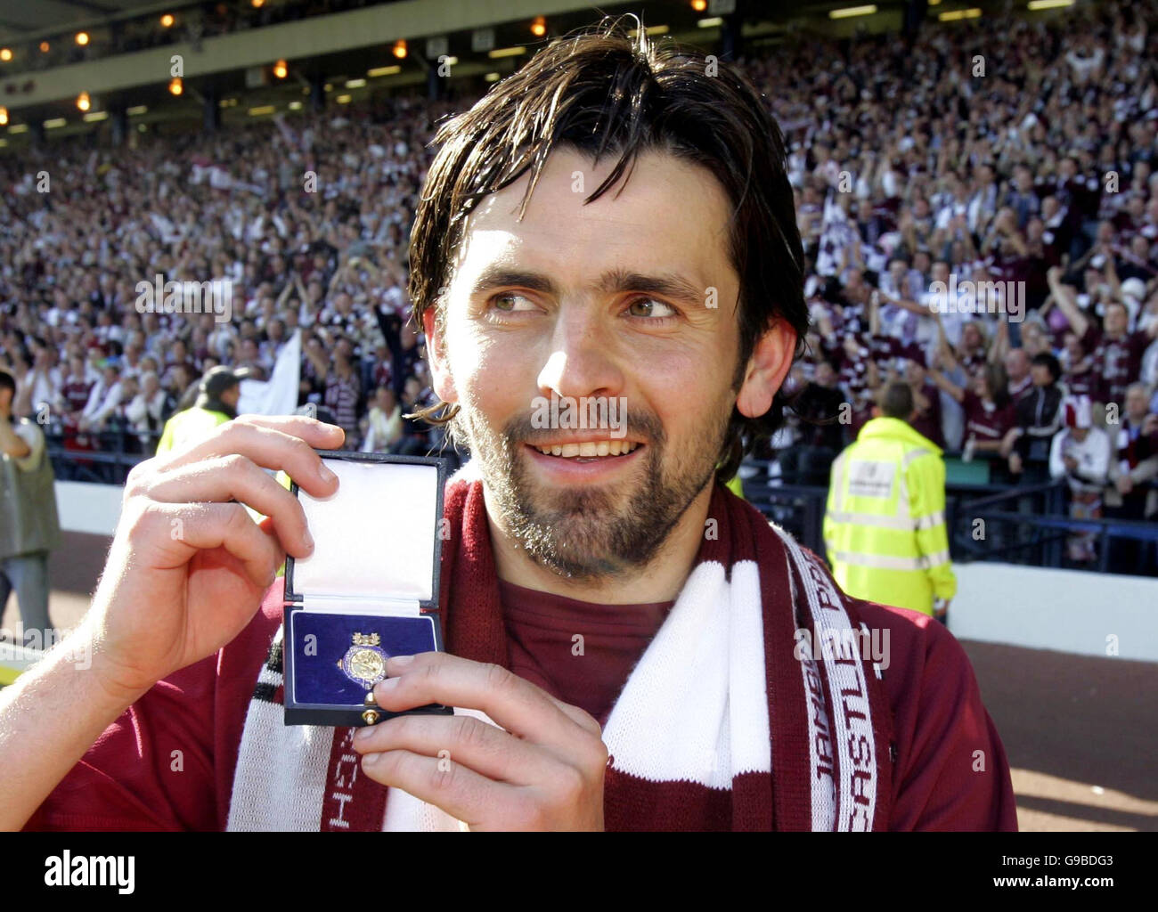 Hearts' Paul Hartley with his winners medal after the Tennents Scottish ...
