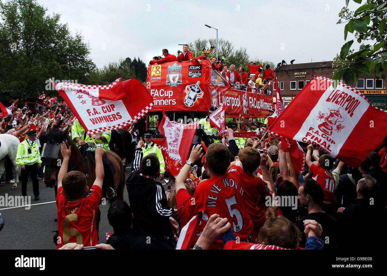 Liverpool fans line the streets as Liverpool players celebrate from ...