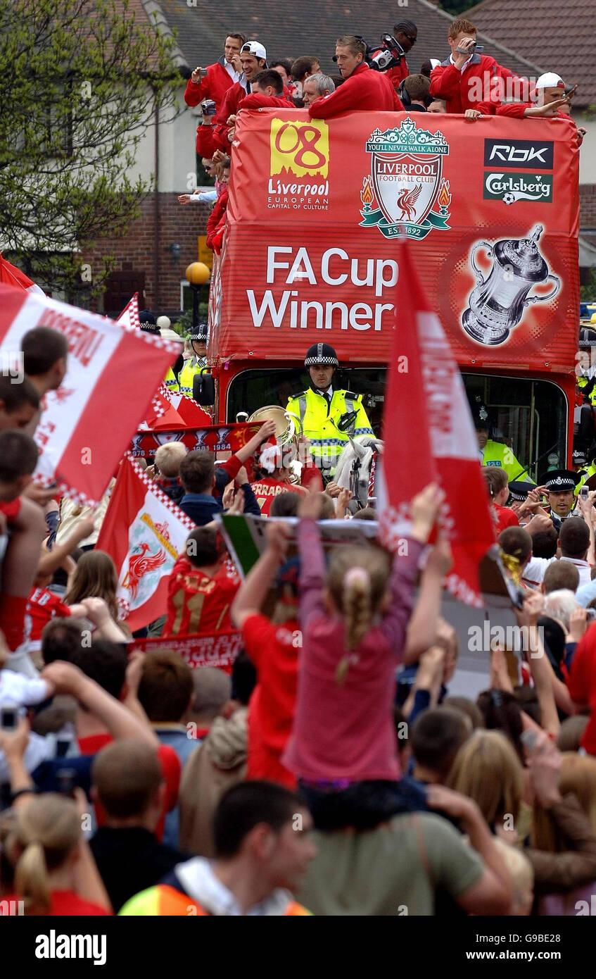 Liverpool fans line the streets, as Liverpool players celebrate from ...