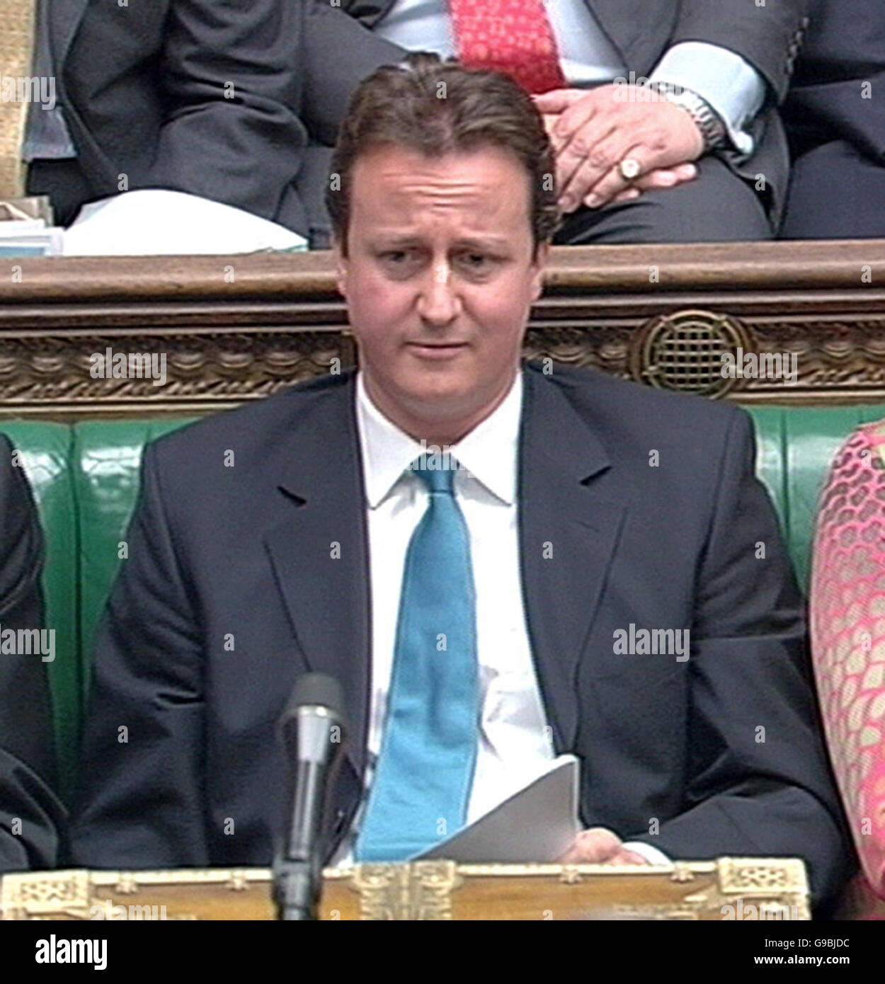 Conservative party leader David Cameron reacts in the House of Commons ...