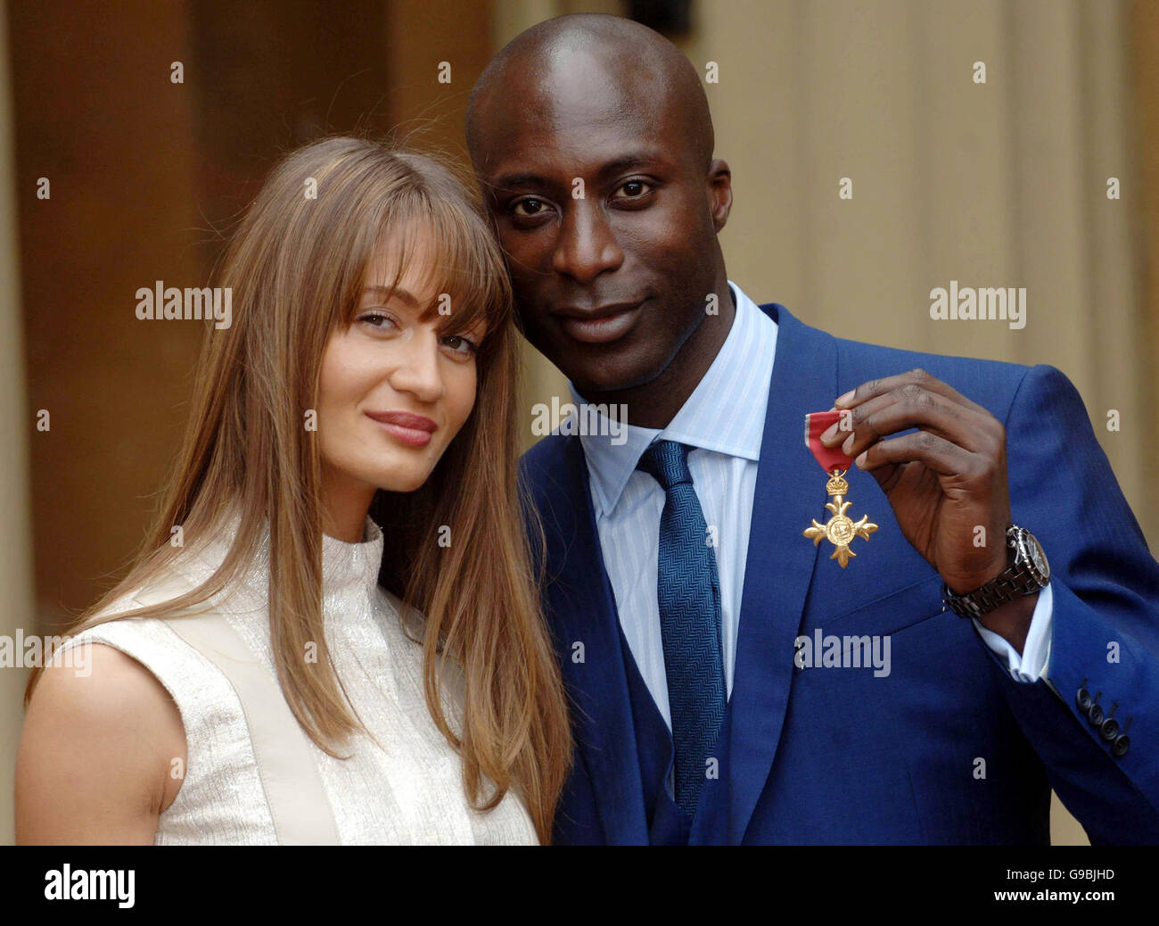 Designer ozwald boateng and his wife gyunel at buckingham palace hi-res ...